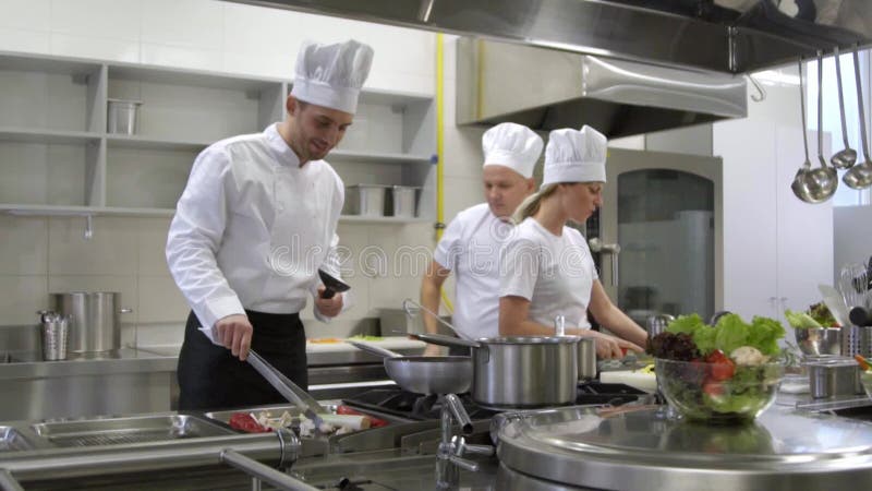 Happy Kitchen Crew with Chef Singing and Dancing while Cooking Stock ...