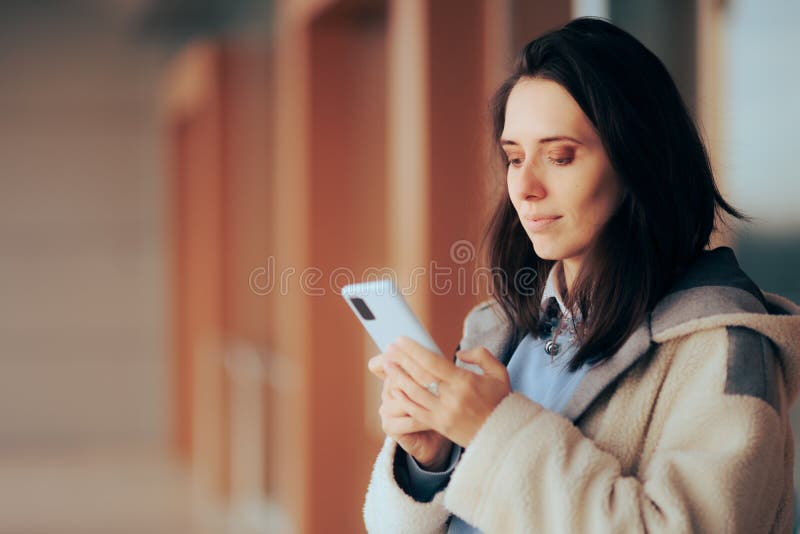Happy Woman Reading a Text Message on Her Phone Stock Image - Image of ...