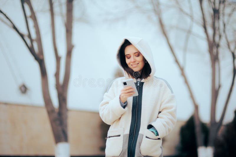 Happy Woman Reading a Text Message on Her Phone Stock Photo - Image of ...