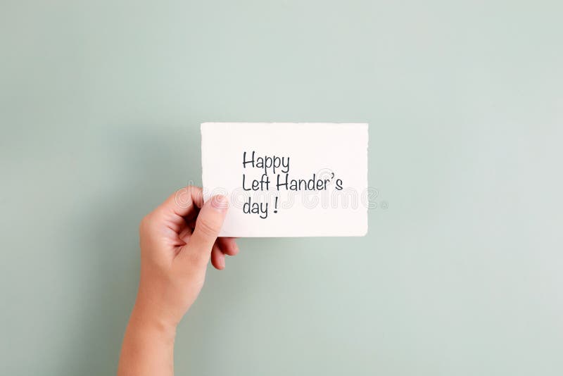 Happy Left Hander S Day. Left Hand Hold White Paper Card and Writing ...