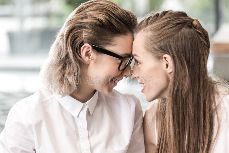 Happy Lesbian Couple Looking At Each Other While Spending Time Together