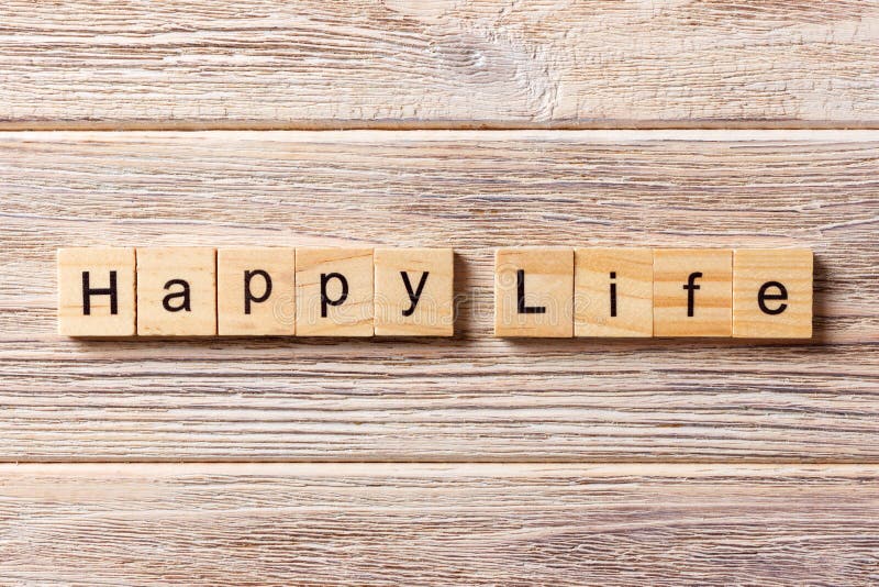 Happy Life Word Written on Wood Block. Happy Life Text on Table ...