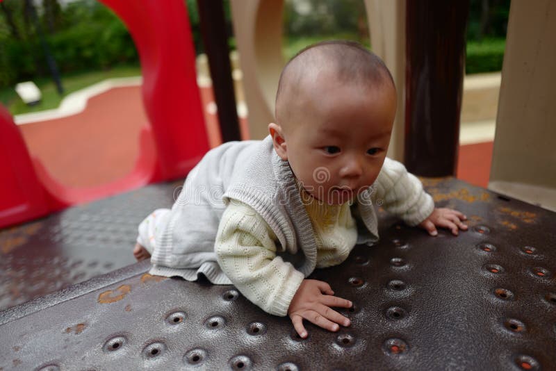 Baby Boy on the Playground Slide Stock Photo - Image of enjoying ...