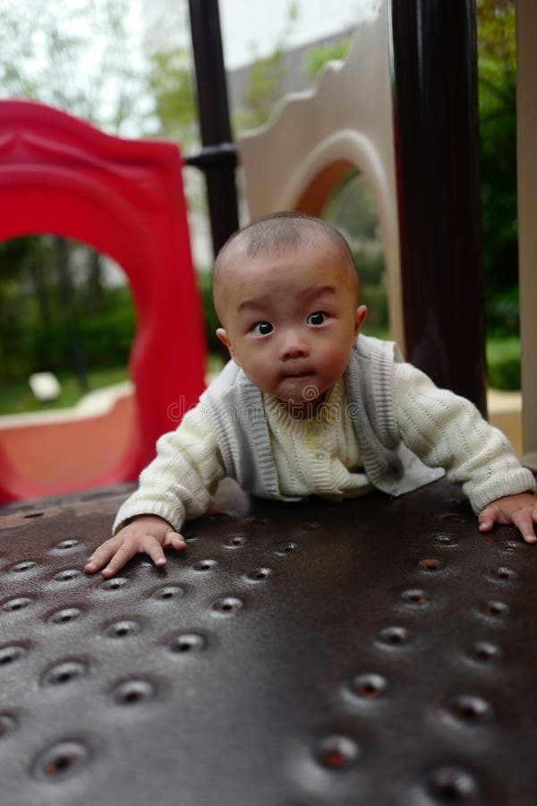 Baby Boy on the Playground Slide Stock Image - Image of male, motion ...