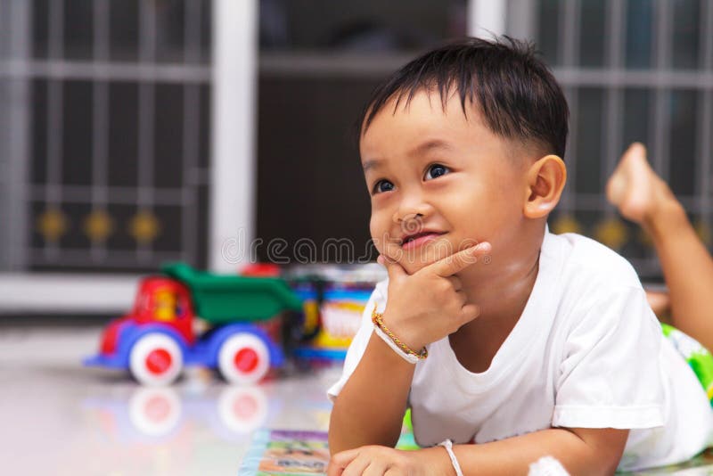 Happy Asian boy with Ipad stock photo. Image of holding - 20405068