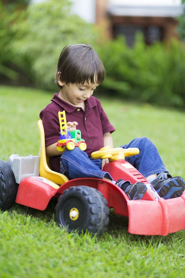 Happy Little Boy Driving a Toy Car Stock Photo - Image of playing ...