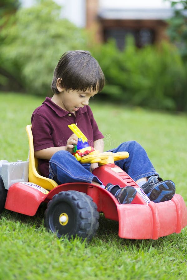 Happy Little Boy Driving a Toy Car Stock Photo - Image of innocence ...