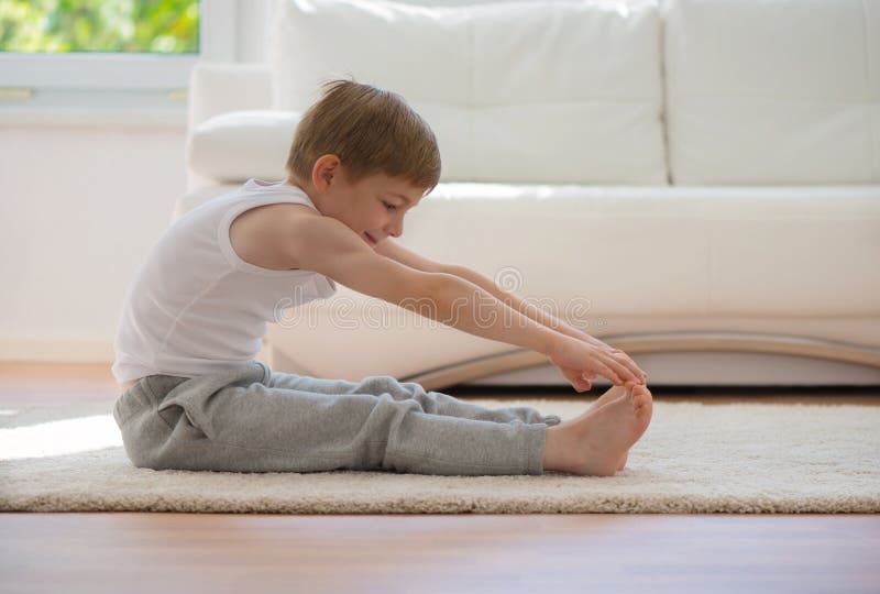 Little Boy Exercising and Stretching in Gym Stock Photo - Image of ...