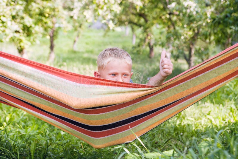 Happy Little Boy in Hammock into the Summer Garden Stock Photo - Image ...