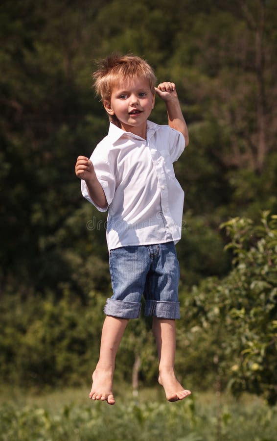 Happy Little Boy is Jumping Outdoor. Stock Photo - Image of person ...