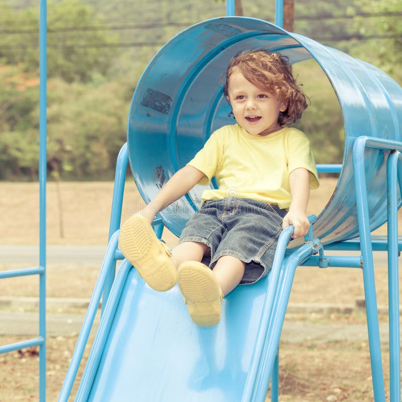Happy Little Boy on the Playground Stock Photo - Image of laughing ...