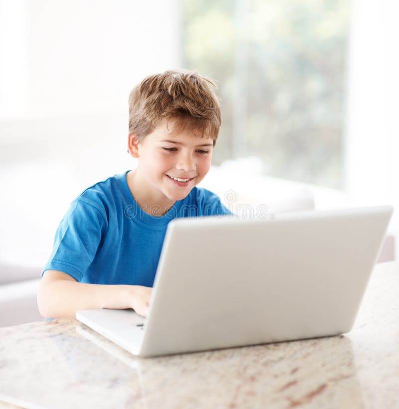 Happy Little Boy Playing a Game on Laptop - Indoor Stock Image - Image ...