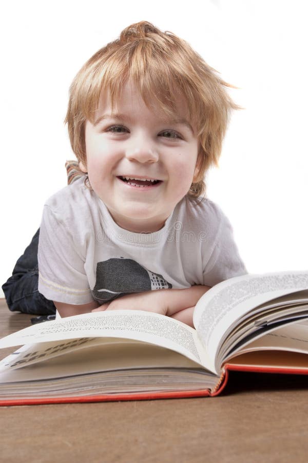 Happy Little Boy Reading and Smiling Stock Image - Image of male, enjoy ...