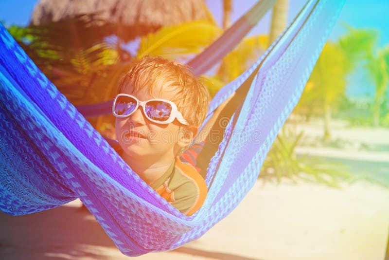 Happy Little Boy Relaxed in Hammock on the Beach Stock Photo - Image of ...