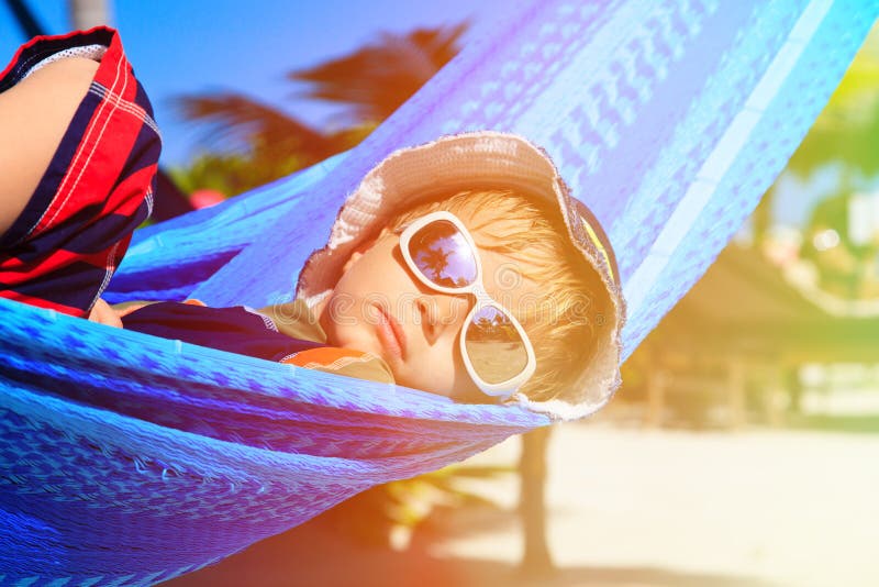 Happy Little Boy Relaxed in Hammock on the Beach Stock Photo - Image of ...