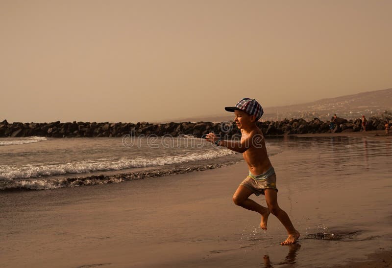 Happy Little Boy Run Play with Waves on Beach. Stock Photo - Image of ...