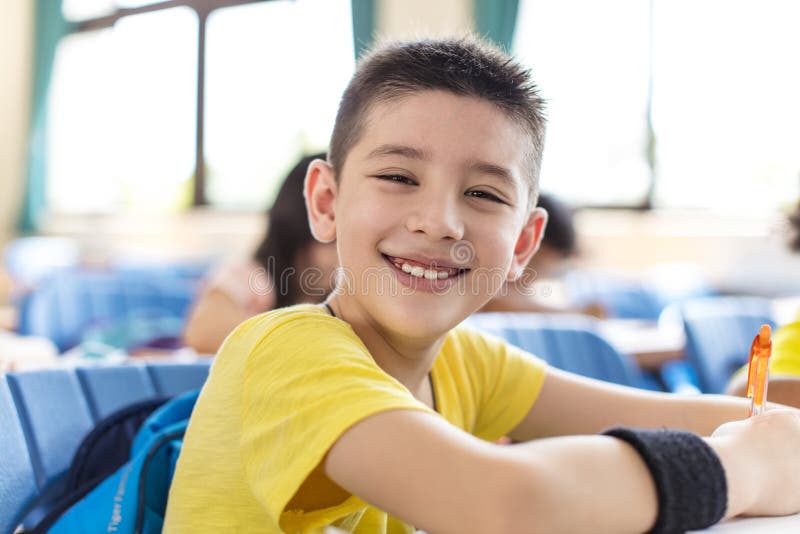 Happy Little Boy Studying in the Classroom Stock Image - Image of study ...