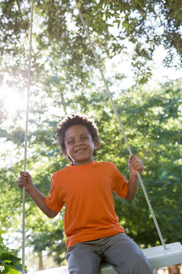 Happy Little Boy on a Swing in the Park Stock Photo - Image of male ...