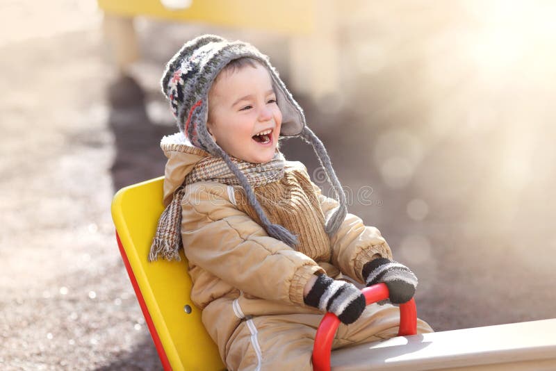 Happy Little Boy Swinging on a Swing Stock Photo - Image of laughing ...
