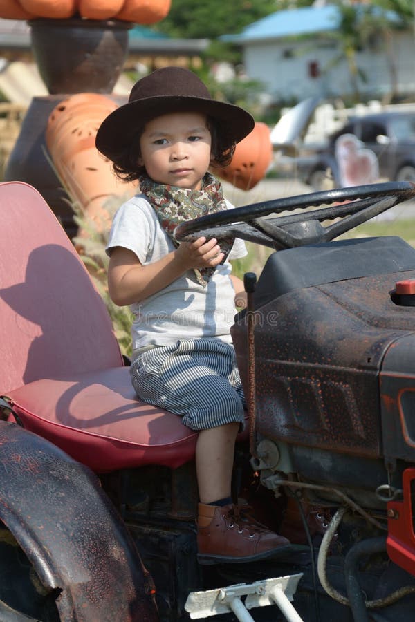 Happy Little Boy of Two Years Having Fun on Tractor in Summer Stock ...