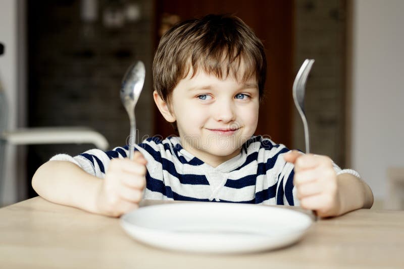 Hungry Boy with Beautiful Eyes Waiting for Dinner Stock Photo - Image ...