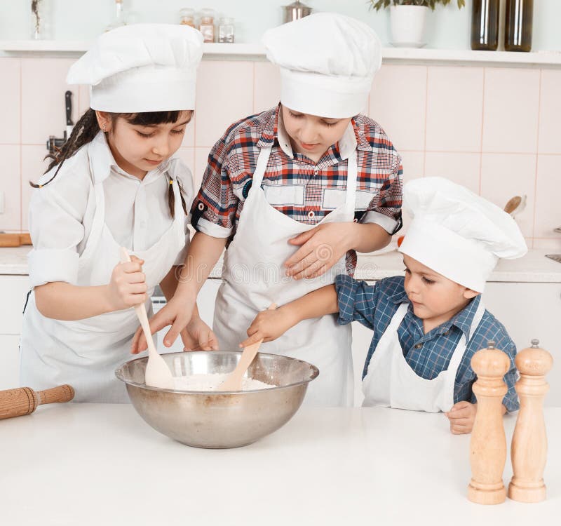 Happy Little Chefs Preparing Dough in the Kitchen Stock Photo - Image ...