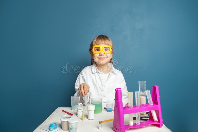 Happy Little Girl with Conical Flasks in School Classroom Stock Image ...