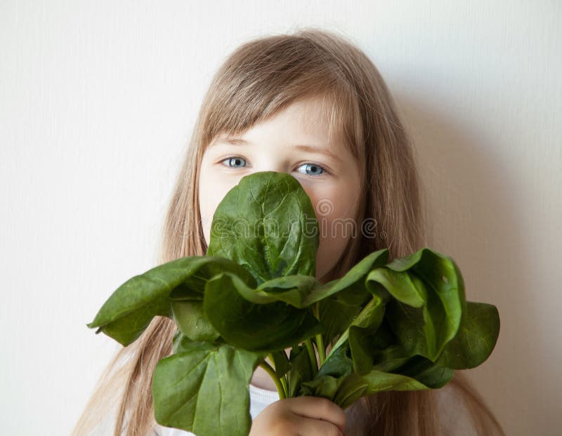 Happy Little Girl Holding Bunch Spinach Stock Photos - Free & Royalty ...