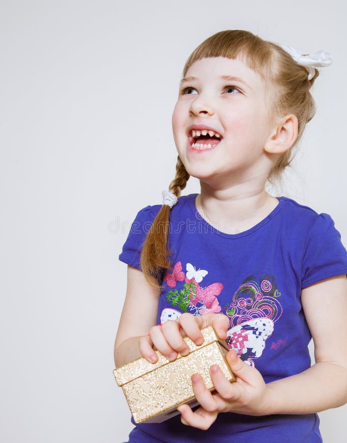Happy Little Girl Holding Gift Box Stock Photo - Image of pending ...
