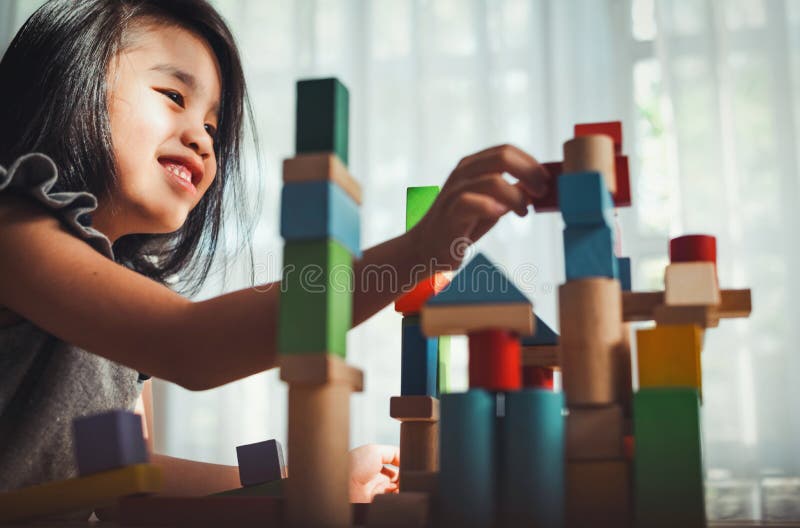 Happy Little Girl Playing Game Building Constructor Tower from ...