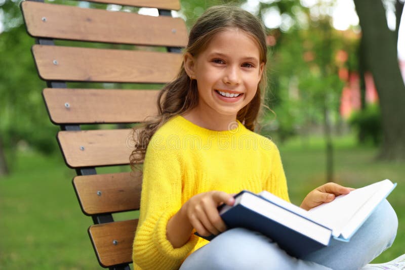 Happy Little Girl Reading Book in Park Stock Image - Image of growth ...