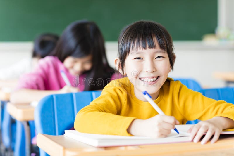 Happy Little Girl Student Studying in the Classroom Stock Photo - Image ...