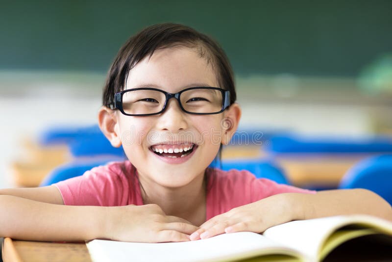 Happy Little Girl Studying in the Classroom Stock Photo - Image of read ...