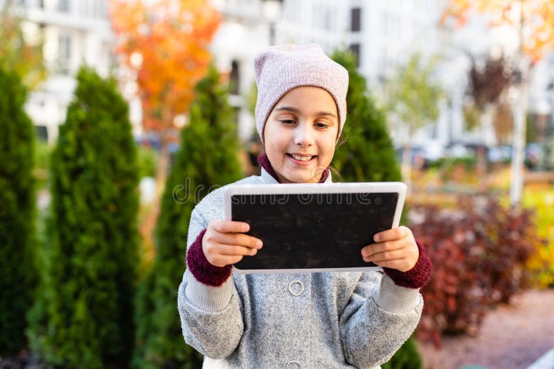 Happy Little Girl Using Tablet Computer Stock Photo - Image of digital ...