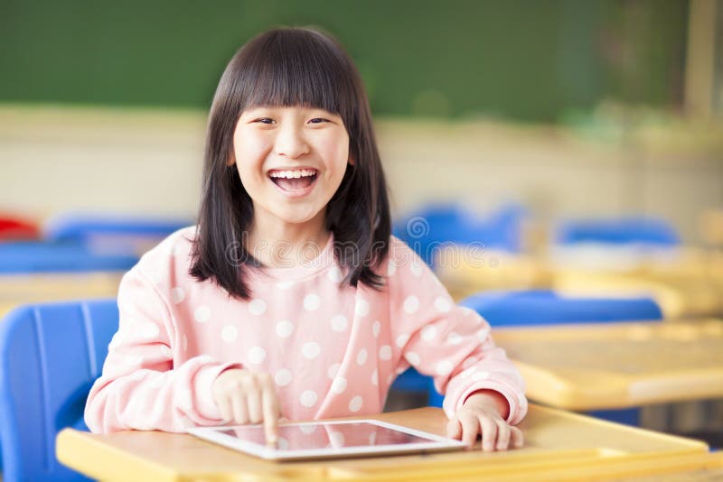 Happy Little Girl Using Tablet or Ipad Stock Photo - Image of computer ...