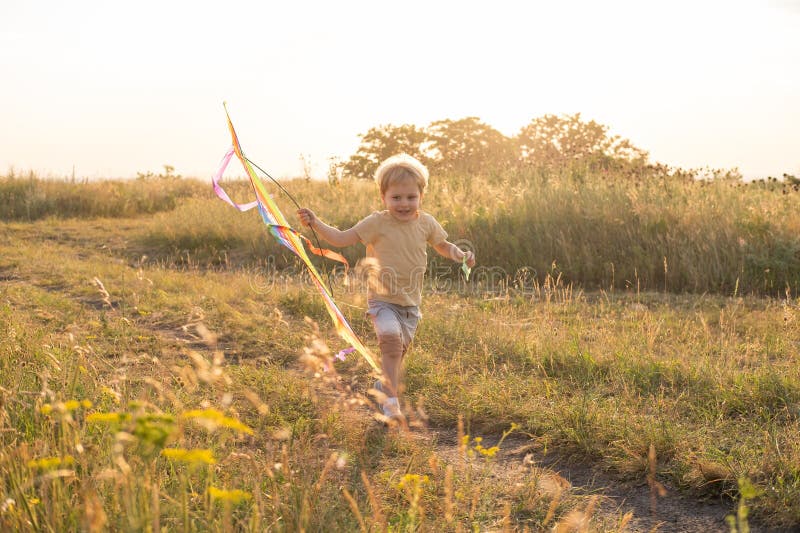Happy Little Kid Boy Having Fun with Kite in Nature at Sunset Stock ...
