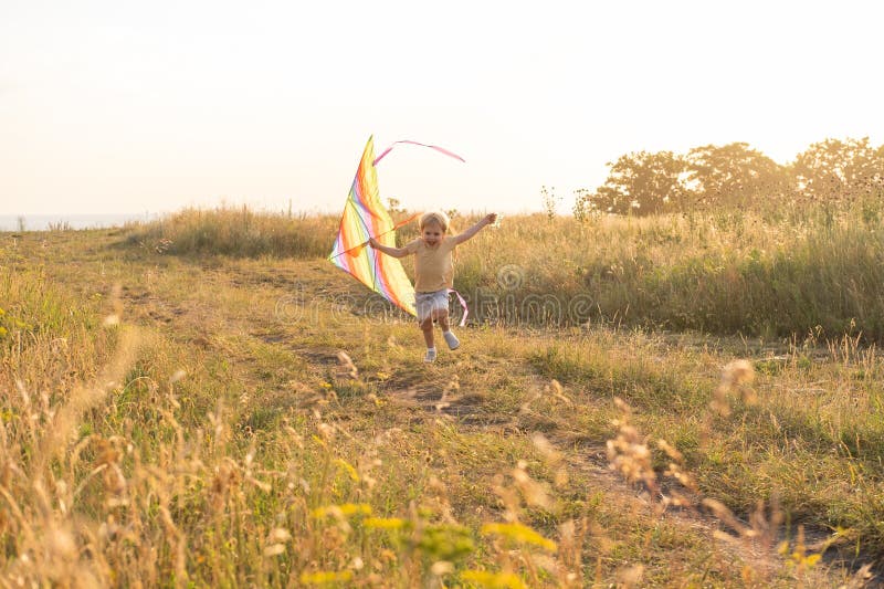 Happy Little Kid Boy Having Fun with Kite in Nature at Sunset Stock ...