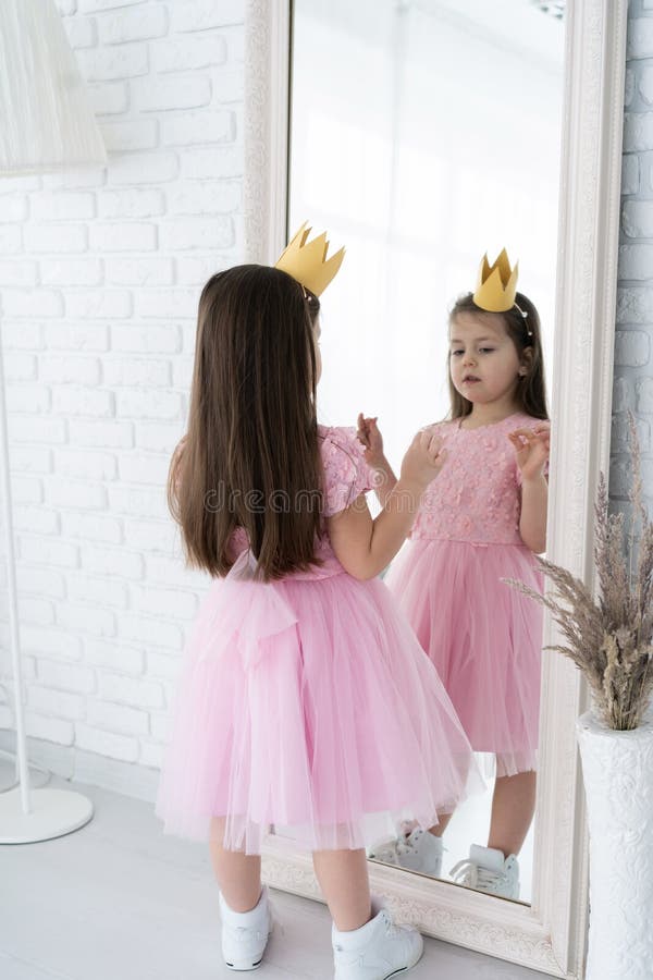 Happy Little Princess Look in To the Mirror. Stock Image - Image of ...