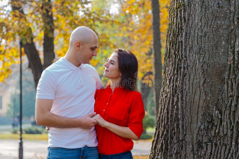 Happy Lovers by a Tree in Autumn in Sunny Weather. Stock Image - Image ...