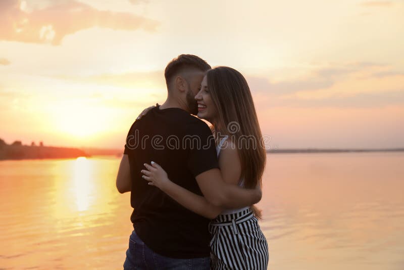 Happy Loving Couple Dancing Near River at Sunset Stock Image - Image of ...