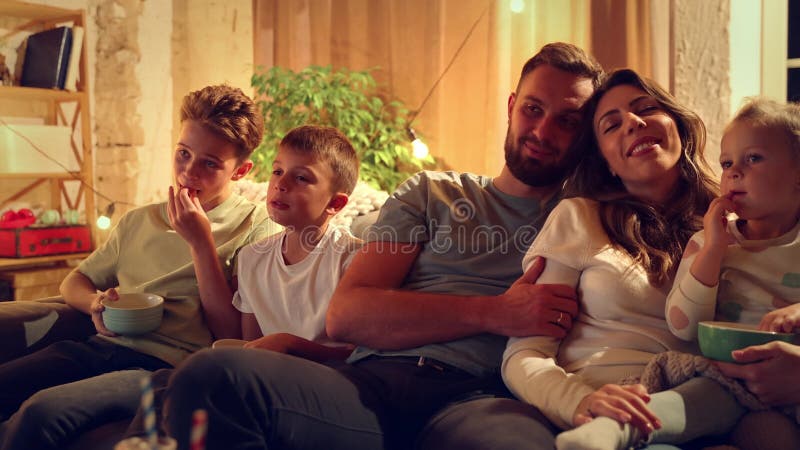 Family Watching Tv Together, Parents and Children Sitting on Couch in ... Family Watching Tv Together, Parents and Children Sitting on Couch in ...