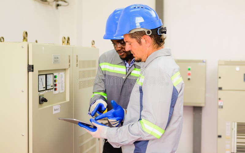 Happy Maintenance Engineer Checking and Maintaining Solar Panels System ...