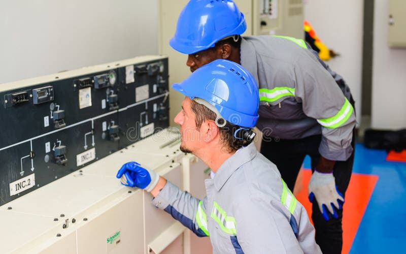 Happy Maintenance Engineer Checking and Maintaining Solar Panels System ...