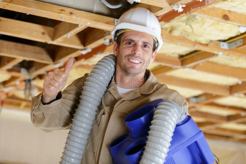 Happy Male Builder Holding Pipe Stock Image - Image of roll, pipeline ...