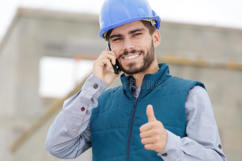 Happy Male Builder on Phone Showing Thumb Up Stock Photo - Image of ...