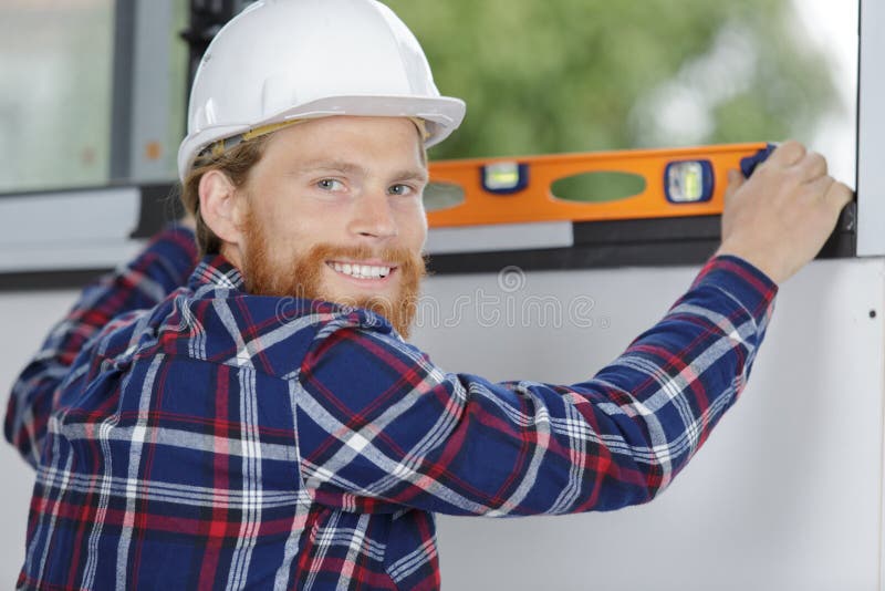 Happy Male Builder in Protective Helmet Holding Level Tool Stock Image ...