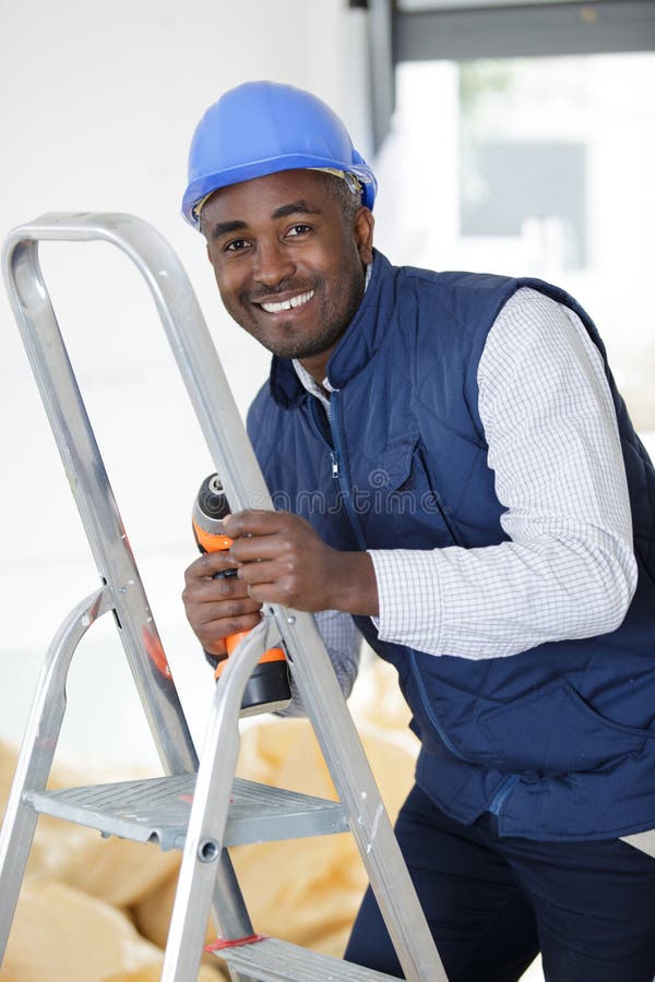Happy Male Builder Standing on Ladder with Drill Stock Image - Image of ...