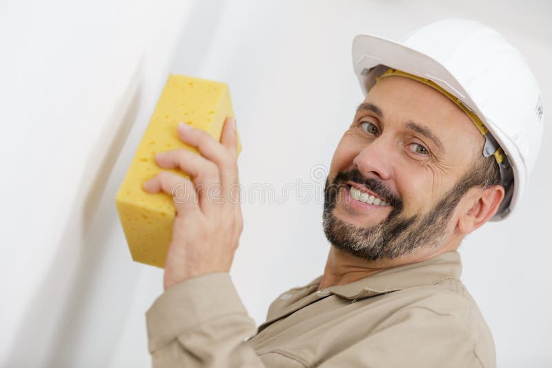 Happy Male Builder Washing Wall after Plastering Stock Photo - Image of ...