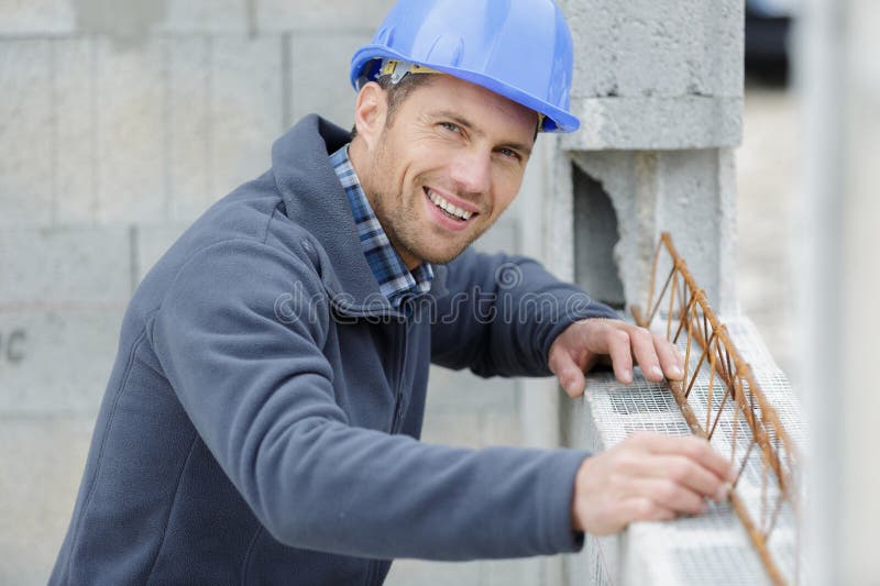 Happy male builder at work stock image. Image of stone - 271108315