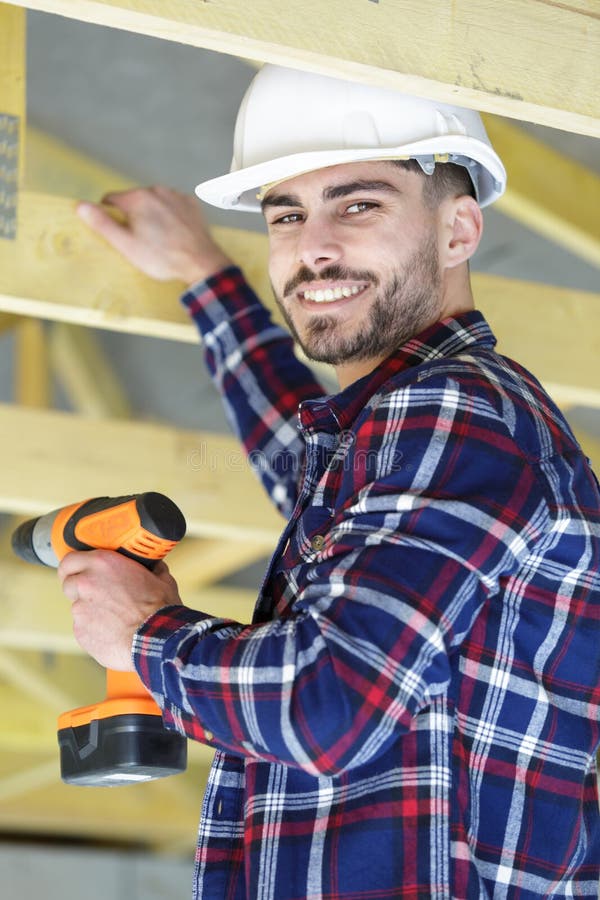 Happy Male Builder Working on Wooden Frame House Stock Image - Image of ...